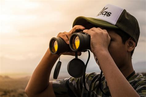 Looking Through Binoculars Photos Download The Best Free Looking