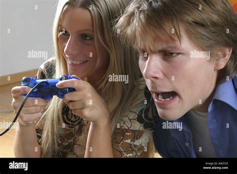 Couple Playing With Play Station Holding Playstation Controller Stock Photo Alamy