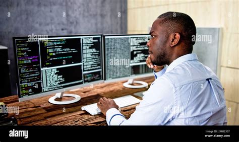 African American Coder Using Computer At Desk Web Developer Stock