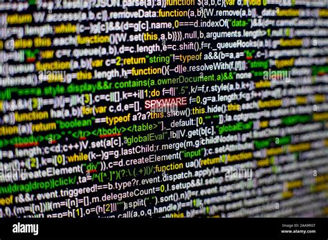 Macro Photo Of Computer Screen With Program Source Code And Highlighted Spyware Inscription In
