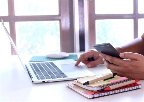 Premium Photo Man Using Laptop On Table At Home