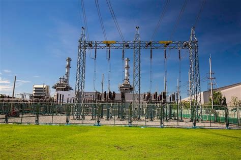 premium photo column high voltage transformer against the field green