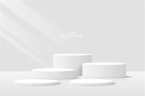 사실적인 흰색 실린더 받침대 연단 세트가 있는 추상적인 부드러운 3d 방입니다 제품 디스플레이 프레젠테이션을 위한 최소한의 장면