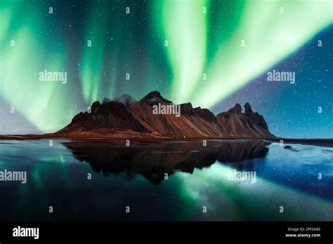 Aurora Borealis Northern Lights Over Famous Stokksnes Mountains On