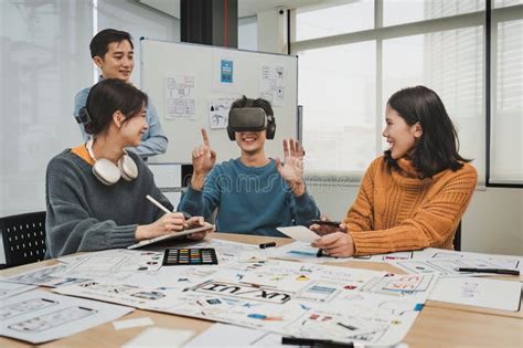 Team Of Ux Developer And Ui Designer Brainstorming Interface Wireframe