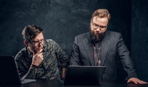 Two Programmers Are Thinking Hard Trying To Find A Solution To The Problem In Office Against A