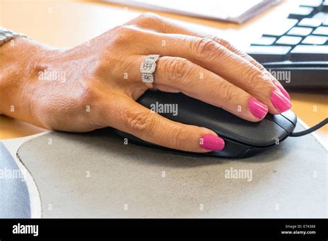 Mature Lady S Hand On Computer Mouse Stock Photo Alamy