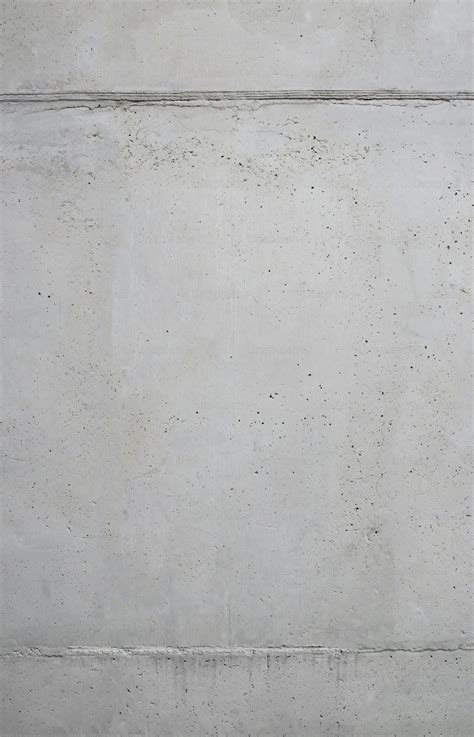 시멘트 벽 위에서 스케이트보드를 타고 있는 남자 사진 Unsplash의 콘크리트 이미지