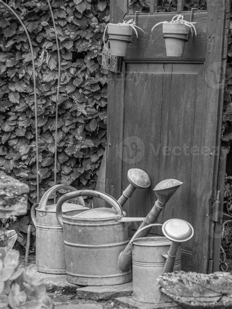 A Black And White Photo Of A Garden With Pots And Pans 75754431 Stock