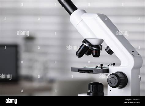 Modern Medical Microscope On Blurred Background Closeup With Space For Text Laboratory