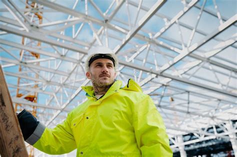 Construction Workers At Work On Modern Building Site Stock Image