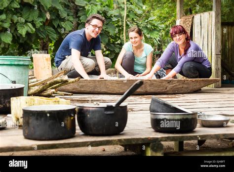 Tourist Preparing Cassava Pie Cassava Root Are Grinded Using