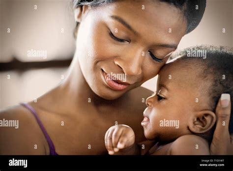 Mother Holding Her Baby Stock Photo Alamy