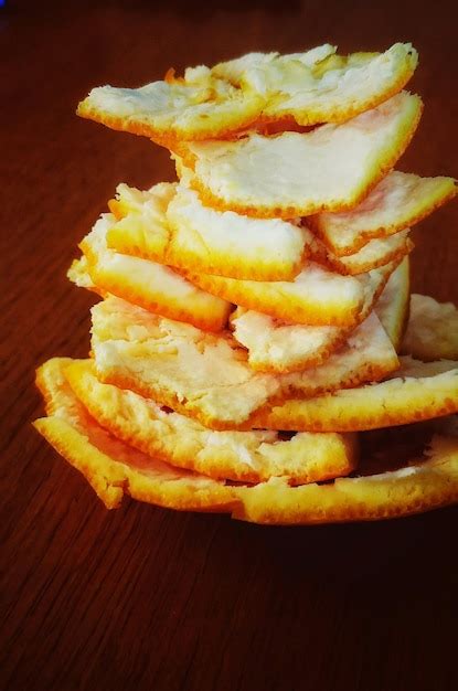 Premium Photo Stack Of Orange Peels On Table