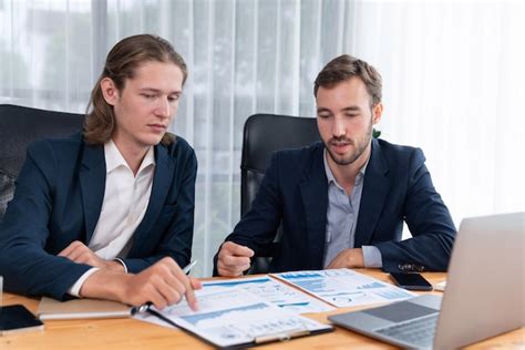Premium Photo Busy Analyst Team In Office Analyzing Financial Data