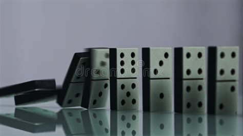 Perfectly Aligned Dominoes Set On Glossy Surface Ready For Cascade