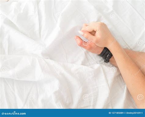 Close Up Hands Of A Couple Make Love Hot Sex On A Bed Stock Image