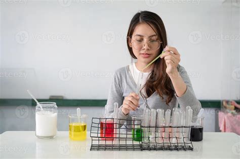 Babe Asian Woman Making Analyzing And Mixing Liquid In Test Tube Color Beaker At Experiment