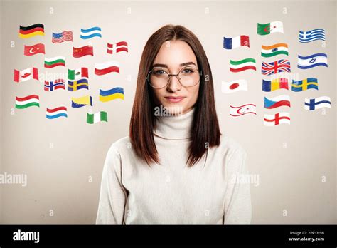 Portrait Of Interpreter And Flags Of Different Countries On Light