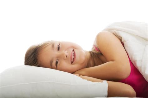 Premium Photo Close Up Portrait Of Girl Lying On Bed Against White