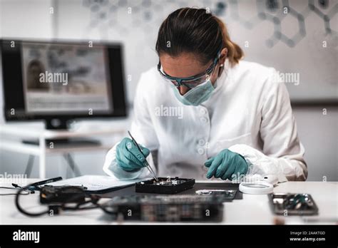 Digital Forensic Science Police Forensic Analyst Examining Computer