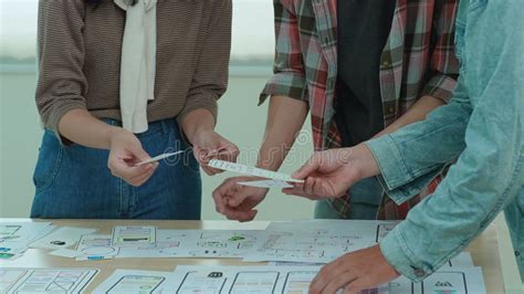 team of creative web graphic designer planning drawing website ux ui app for mobile phone