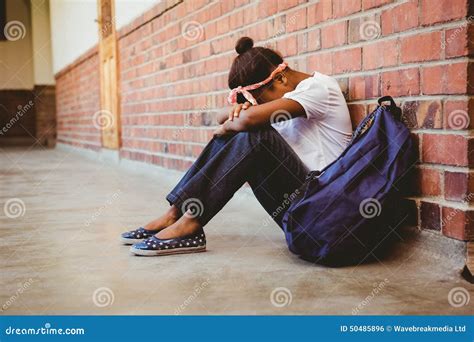 Sad Girl Sitting Against Wall Sad Girl Sitting Against Wall