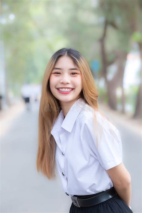 Young Beautiful And Pretty Asian Female College Student Wearing Uniform