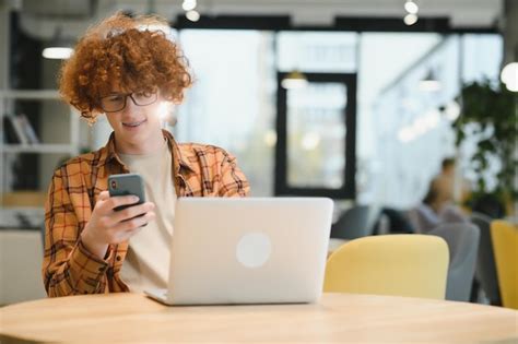 Premium Photo Male Programmer Wear Spectacles For Eyes Protection While Working On Freelance