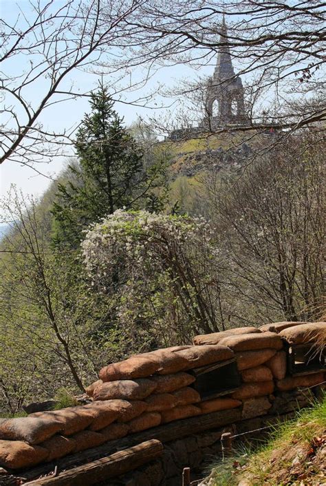 Narrow Trench Dug In The Ground And View Of The Monte Cimone Ossuary In