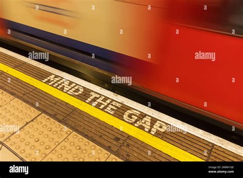 England London London Underground Moving Train With Mind The Gap