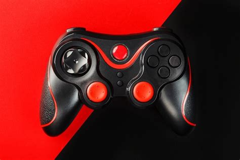 Premium Photo Black Gamepad On A Black Red Surface Gaming Concept