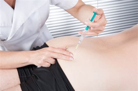 Premium Photo Drug Injection In The Buttock Made By Female Doctor