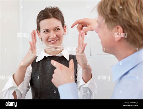 Businesspeople Playing String Game Stock Photo Alamy