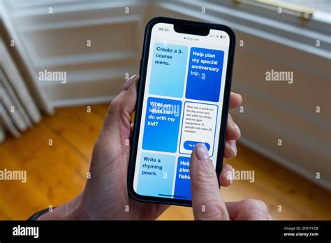 person holds mobile phone showing new microsoft chatgpt openai bing