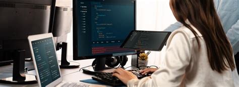 Premium Photo Software Development Team Working Together In Office Coding Script Display On