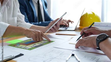 Businessman And Architect Meeting For Planing And Checking House Design