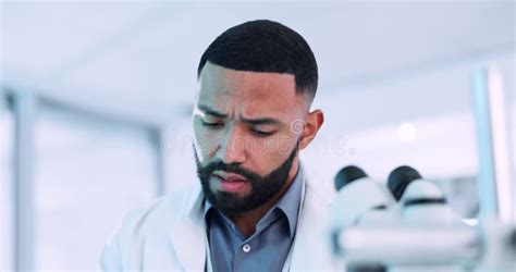 Tablet Microscope And Research With A Man Doctor In A Laboratory For Innovation Or Medical