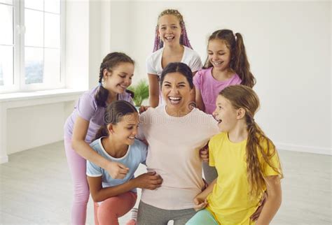 Cheerful Happy Girls Dancers With Teacher Having Fun Together In