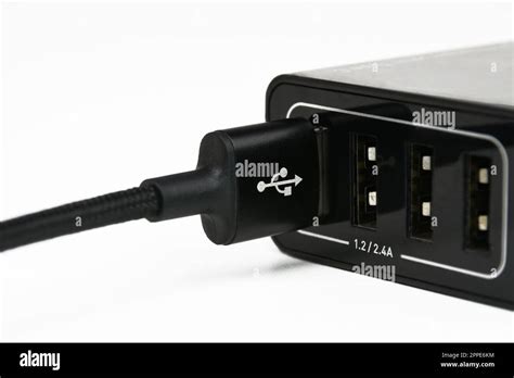 Usb A Charging Cable In Mobile Phone Charger Port On White Background Mobile Phone Equipment