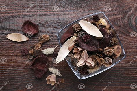 Aromatic Potpourri Of Dried Flowers In Glass Bowl On Wooden Table Flat