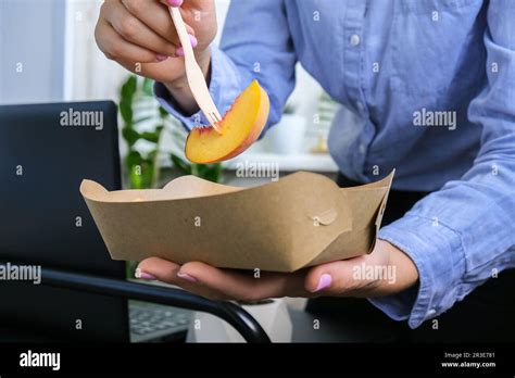 Businesswoman Having A Healthy Lunch Break From Delivered Eco Lunch Boxes Delicious Balanced