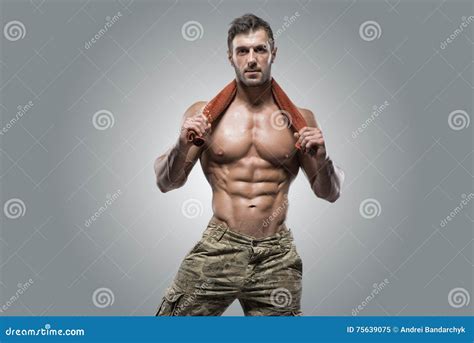 Muscular Athlete Bodybuilder Man On A Gray Background Royalty Free
