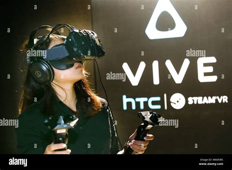 File A Visitor Wears A Vive Virtual Reality Vr Headset With