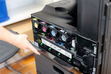 A Girl Checks The Paint In A Color Laser Printer Stock Photo Image Of Industry Photocopier