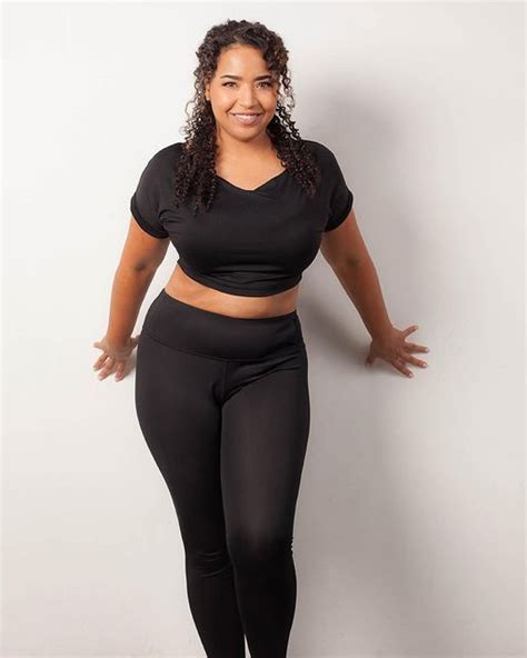 Toronto Curve Fitness Model Posing In Black Workout Gear Against White