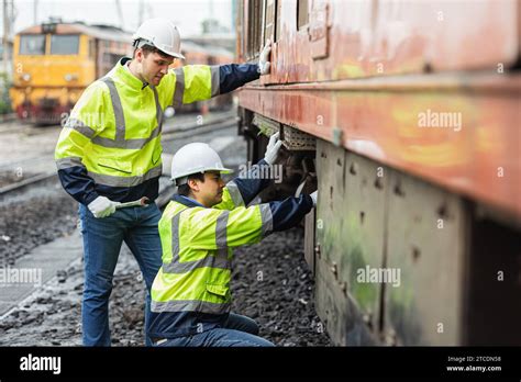 Engineer Team Service Maintenance Old Broken Diesel Train Park At Railway Depot Team Working