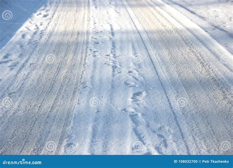 Empty Road With Huge Snow Banks On Sides On Cloudy Winter Day Stock