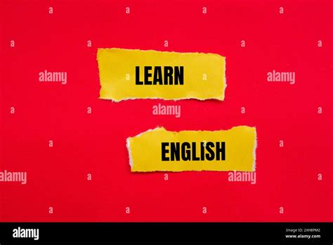 Learn English Message Written On Ripped Torn Yellow Paper Pieces With