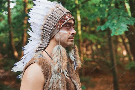 Premium Photo A Man In Traditional Native American Clothing In The